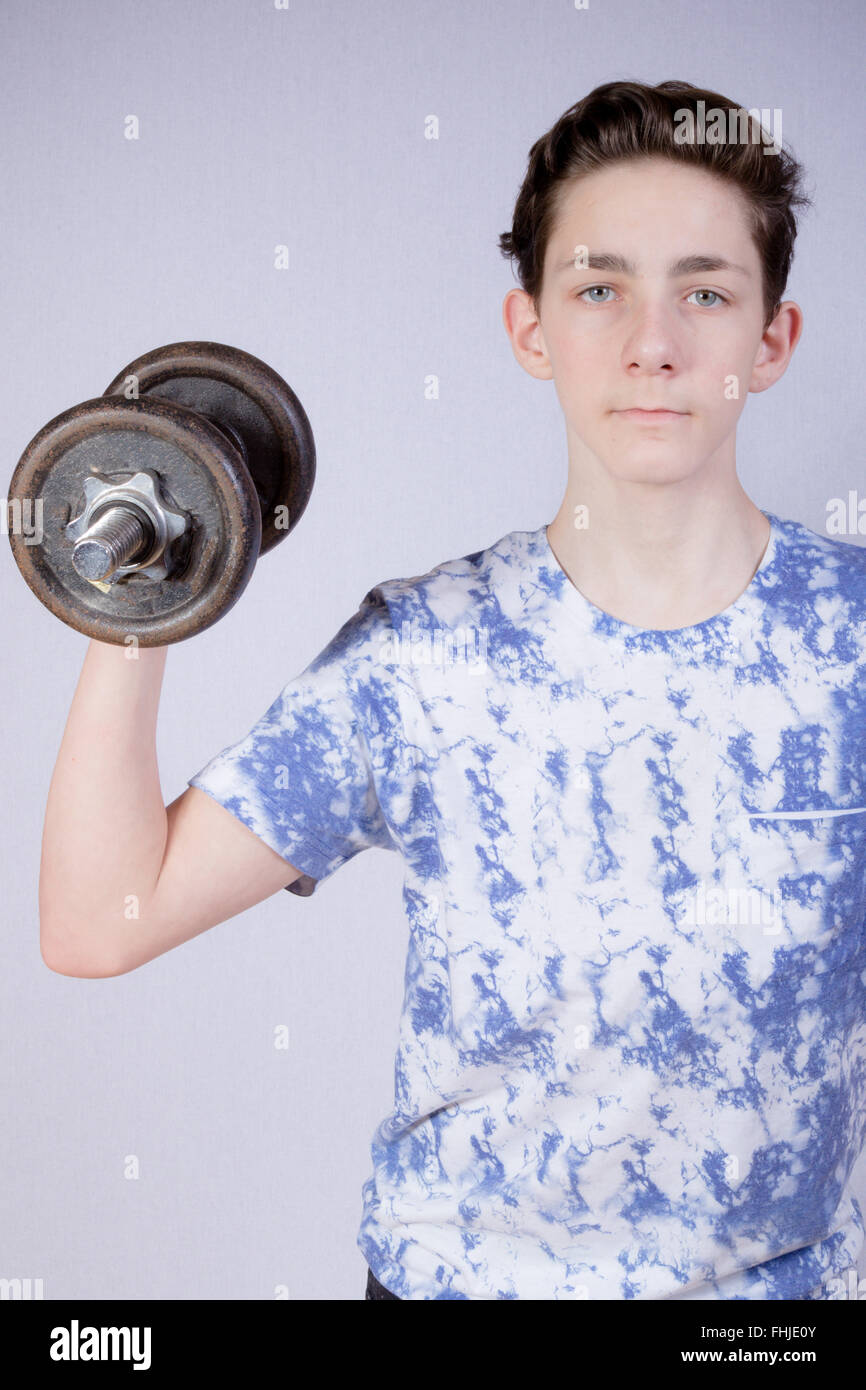Teenage Boy Lifting Weights Stock Photo - Alamy