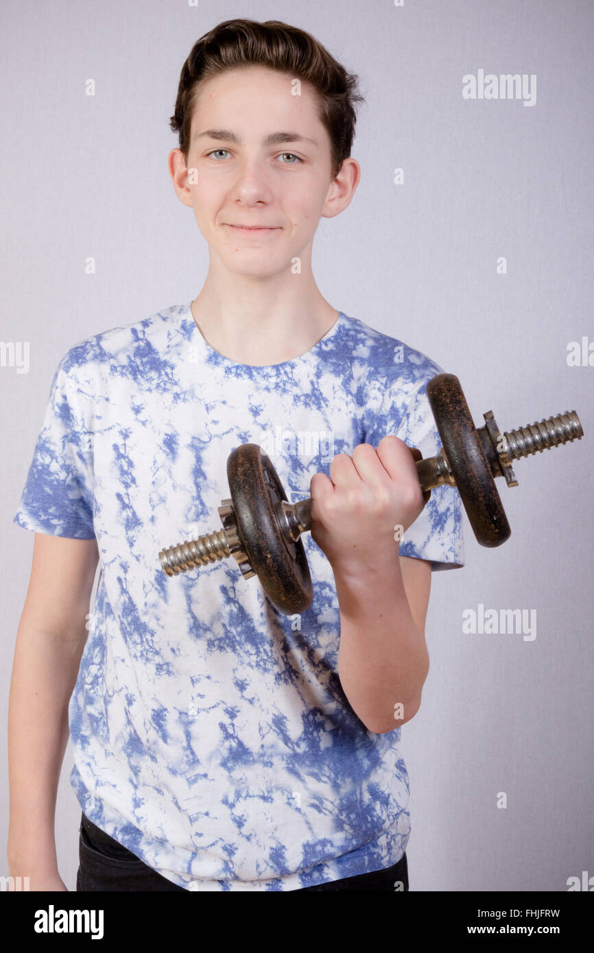 Teenage Boy Lifting Weights Stock Photo - Alamy
