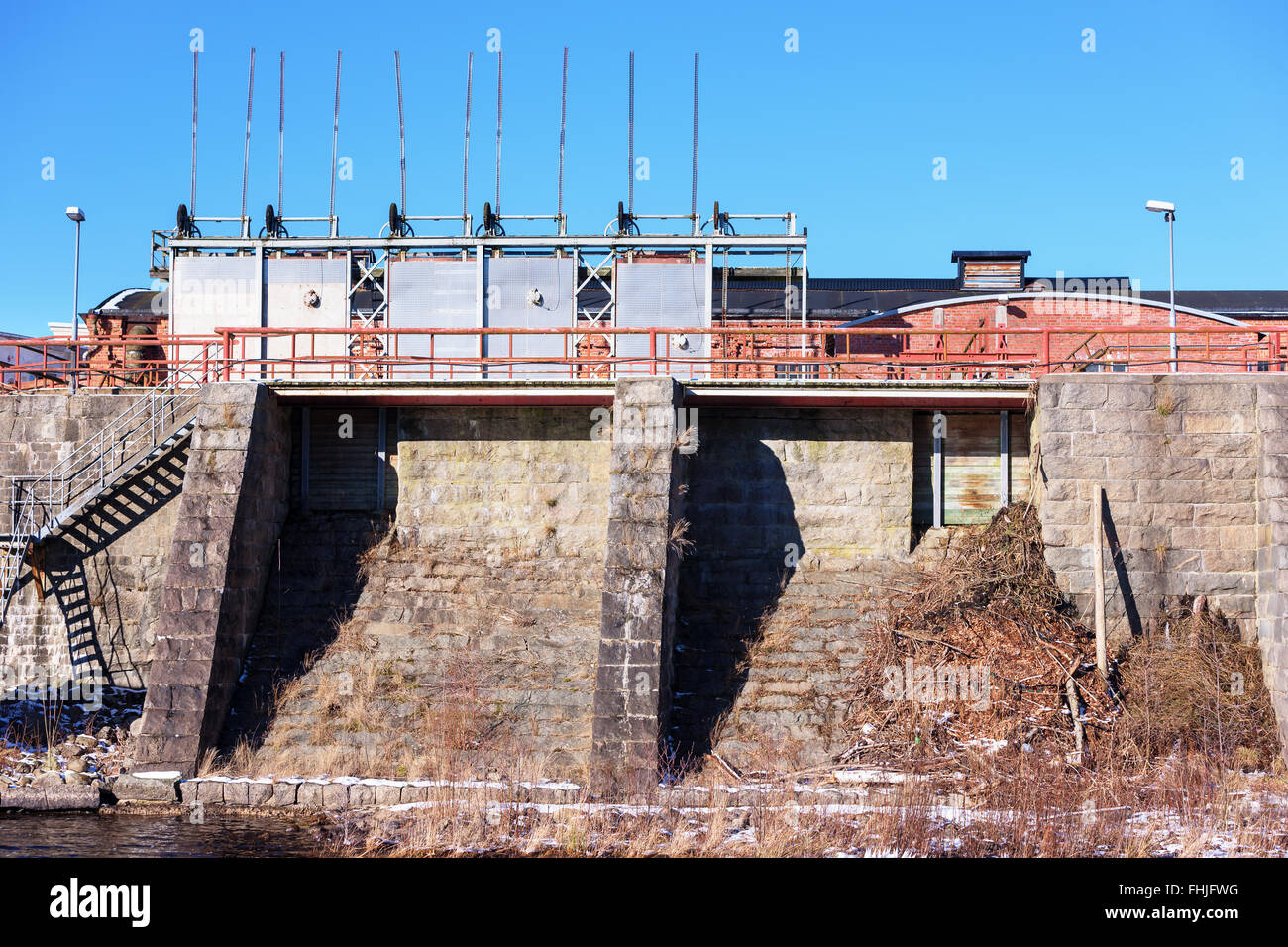 Detail of raised metal water gates at an abandoned paper mill Stock ...