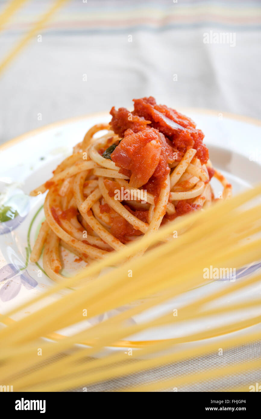 unusual framing of a dish of spaghetti with pummarola with some ...