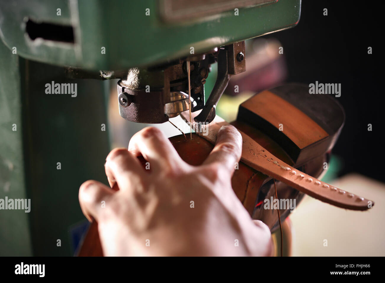 Elegant but masculine, manual precision work shoemaker. Sewing machine ...