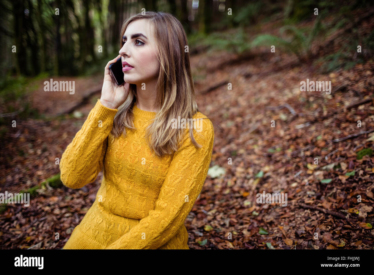 Pretty blonde woman having a phone call Stock Photo - Alamy