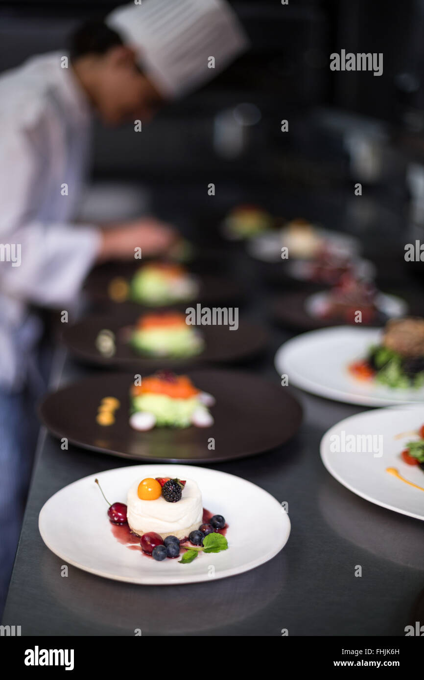 Happy chef with her dishes Stock Photo - Alamy