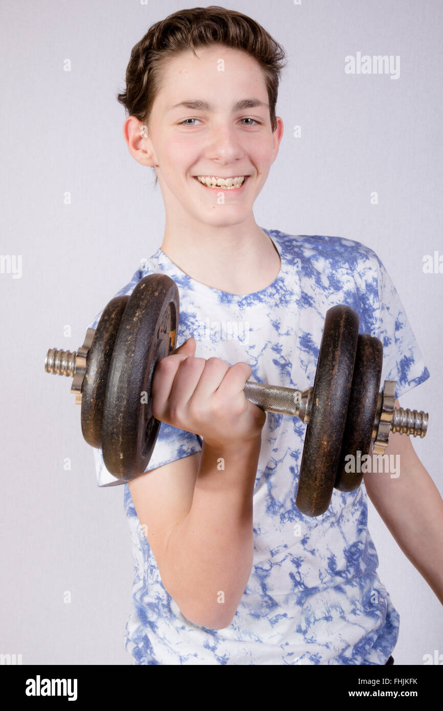 Teenage Boy Lifting Weights Stock Photo - Alamy
