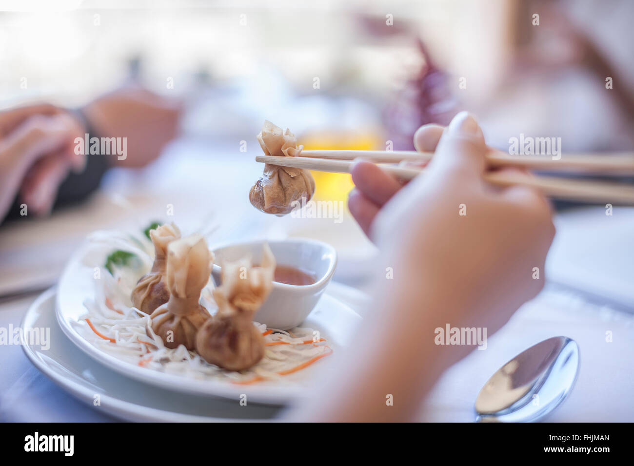 Asian person eating dumpling hi-res stock photography and images - Alamy