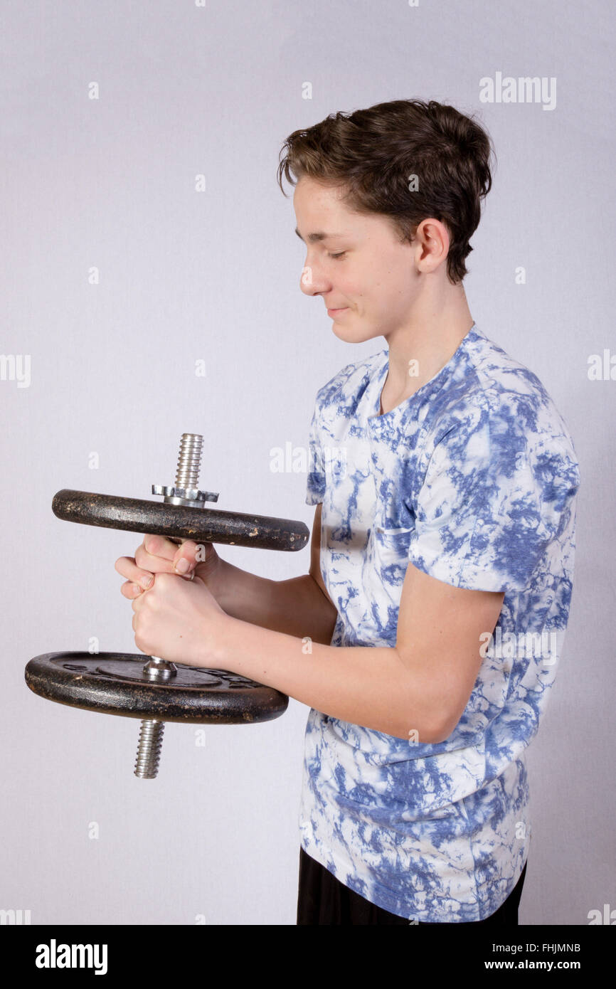 Teen boy weight lifting hi-res stock photography and images - Alamy