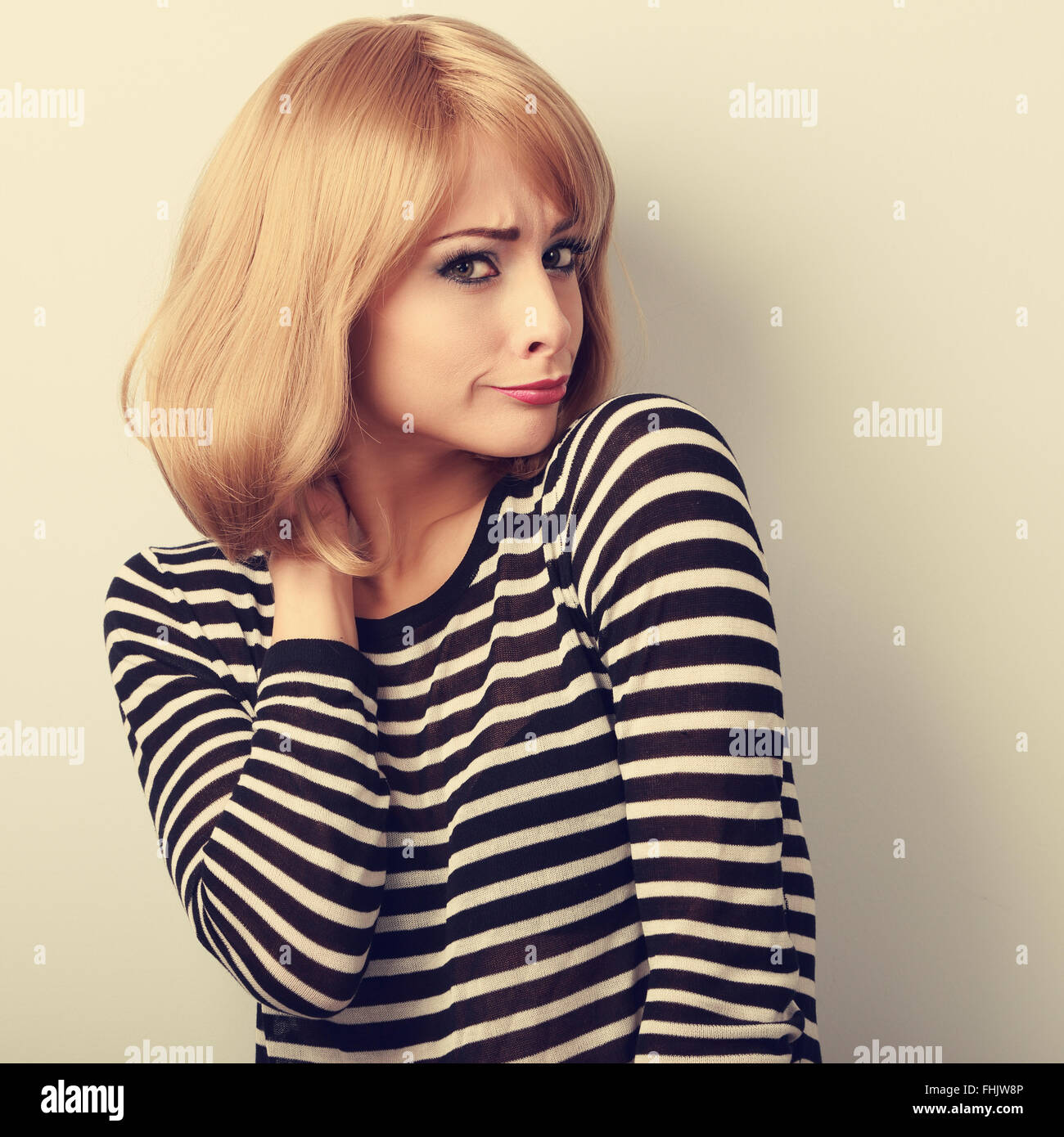 Displeased suspicious blond woman looking skeptical. Toned closeup ...