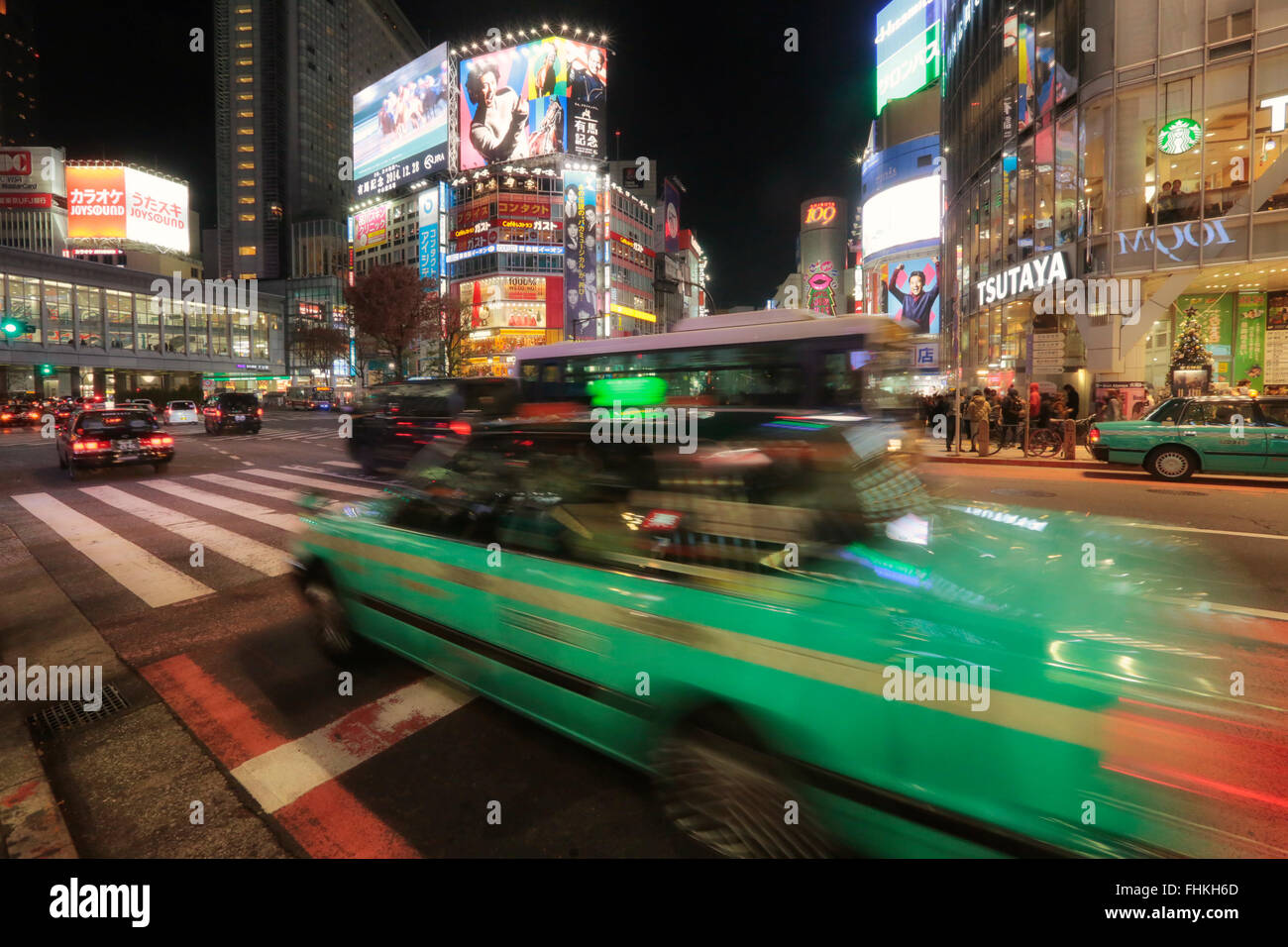 Neon lights by the worlds busiest crossing in Shibuya,Tokyo Stock Photo ...