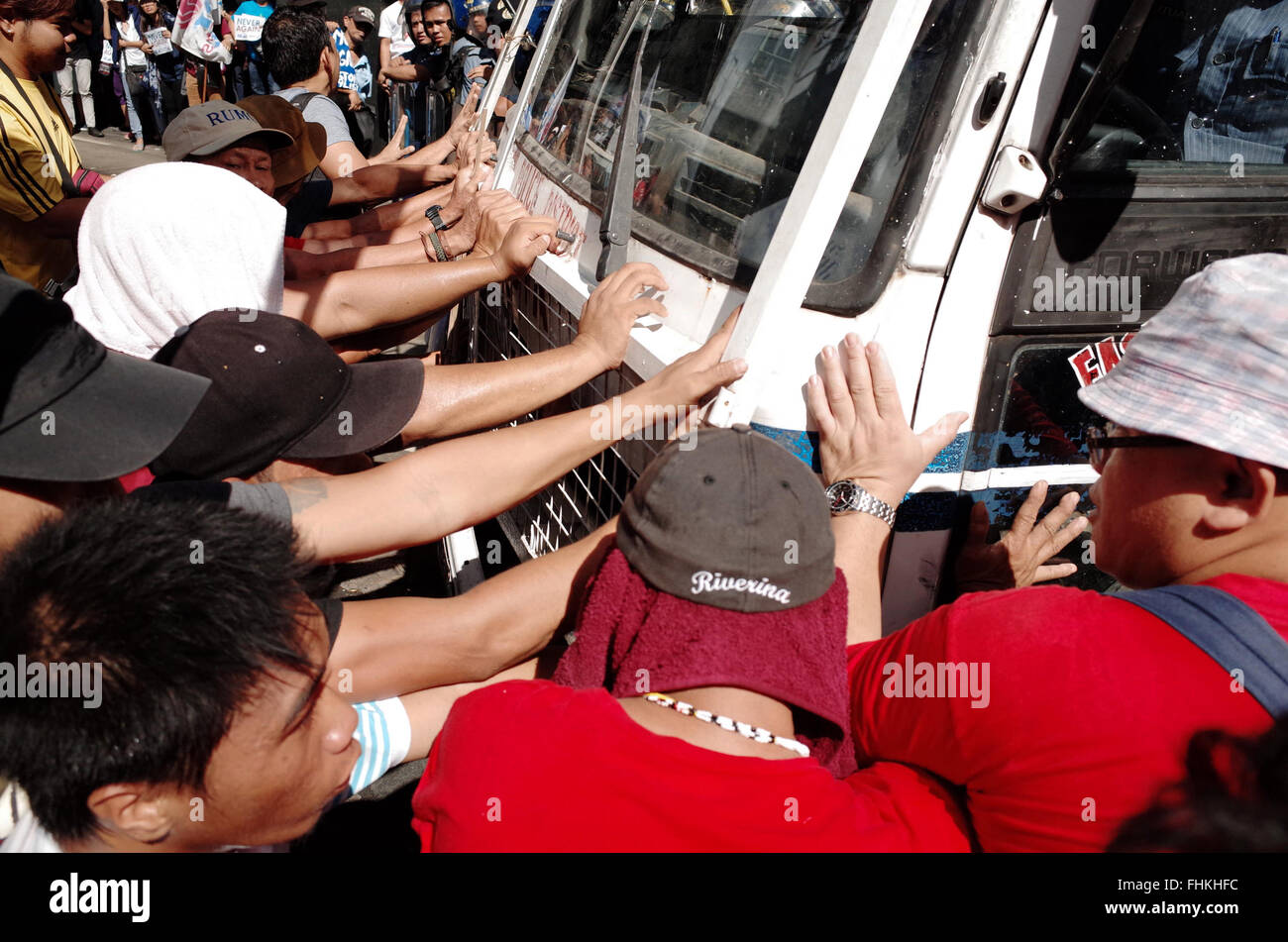 Manila, Philippines. 25th February, 2016. Filipino protesters attempt ...