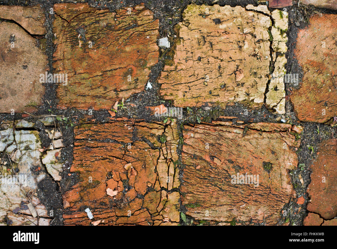 the texture of the old bricks made of clay, with cracks and splits ...