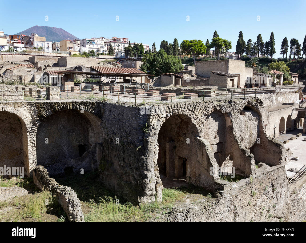 Herculaneum ruins with the modern town and Vesuvius in the background ...