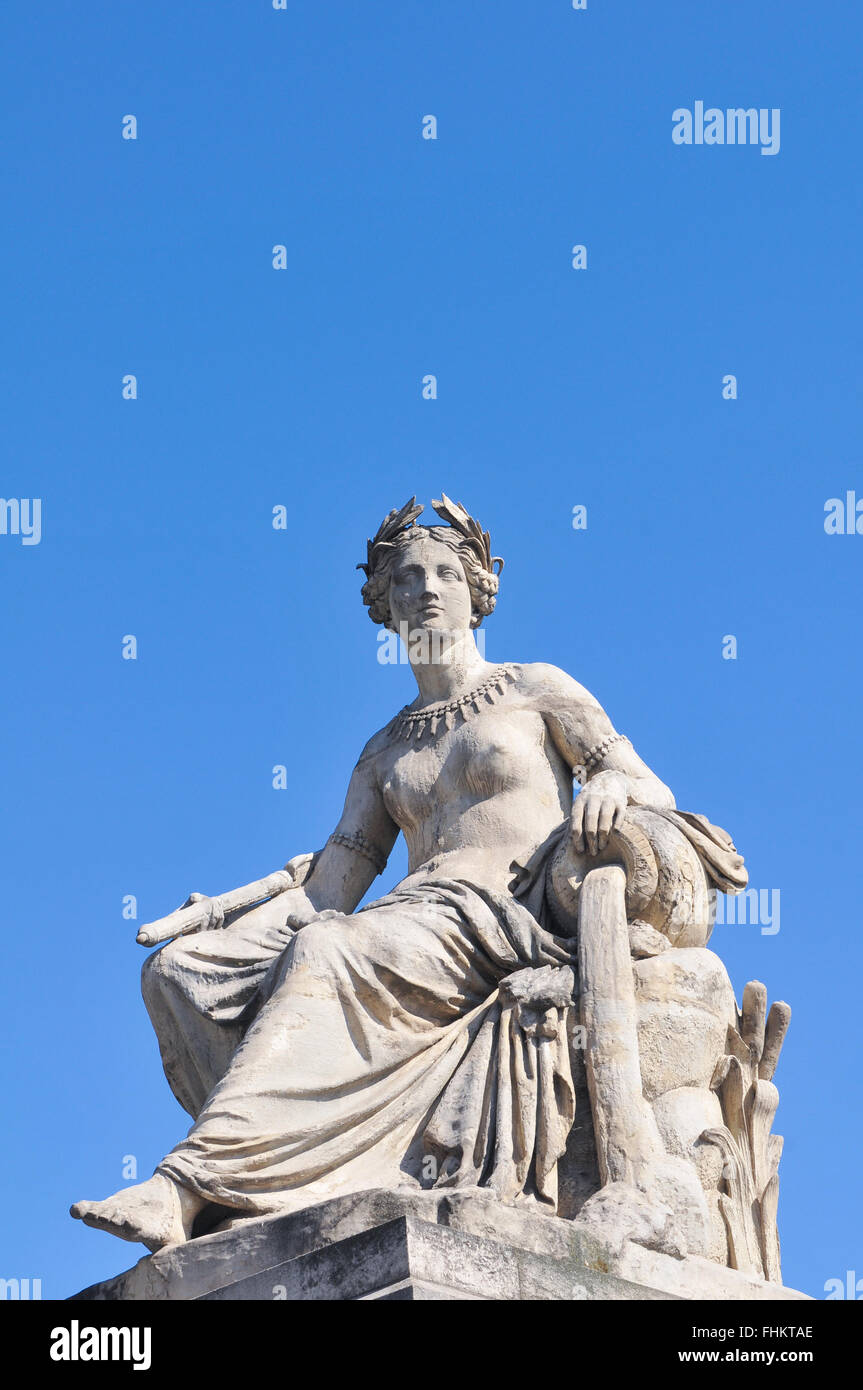 Architectural detail of statue depicting woman pouring water against ...
