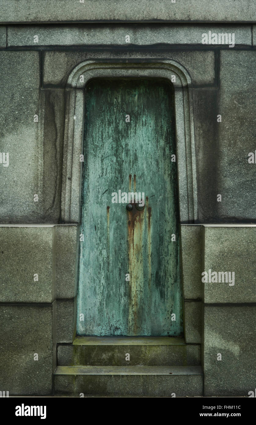 Distressed metal door to tomb, green patina Stock Photo - Alamy