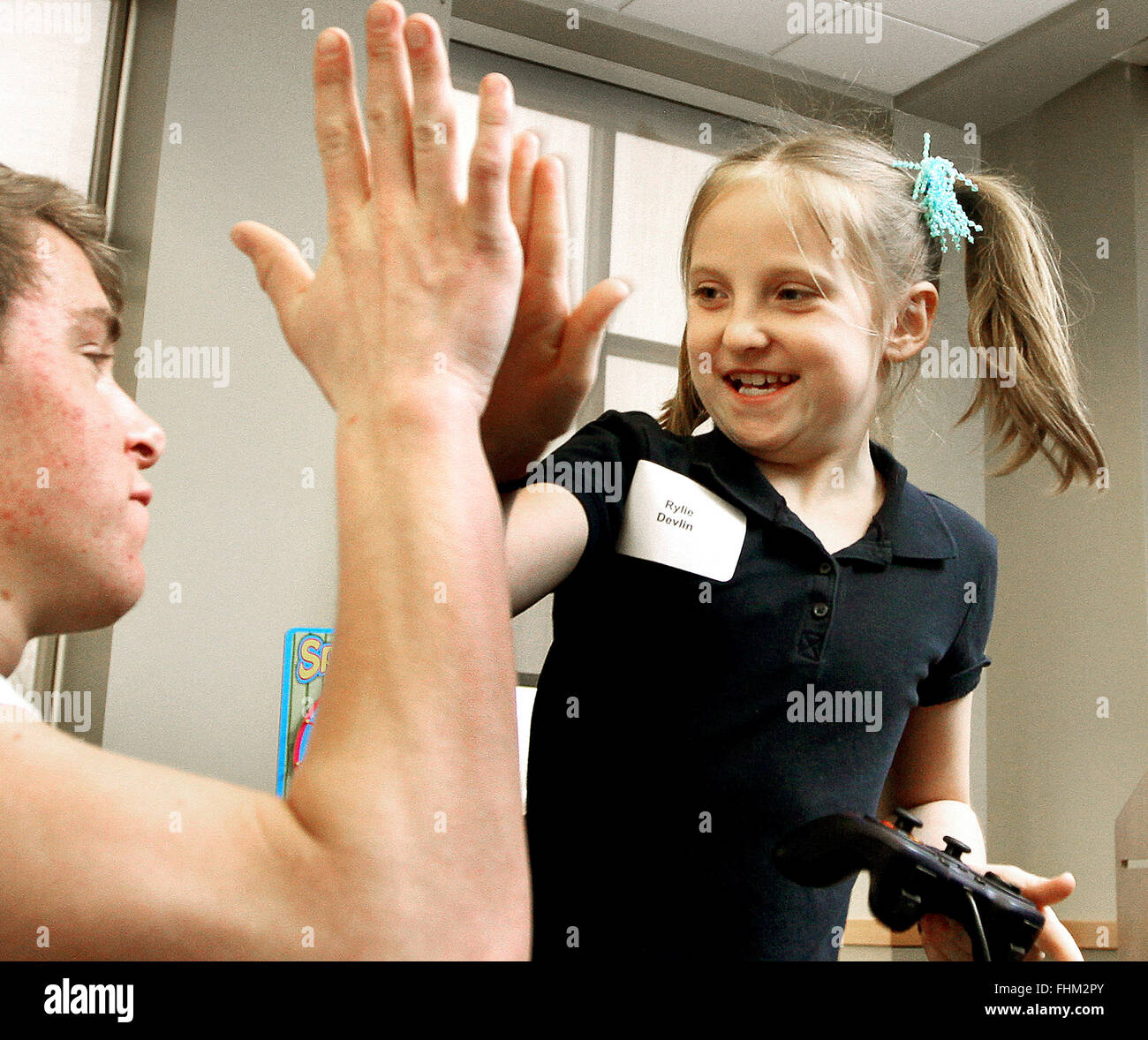 Davenport, Iowa, USA. 23rd Feb, 2016. Austin O'Neil gives Rylie Devlin ...