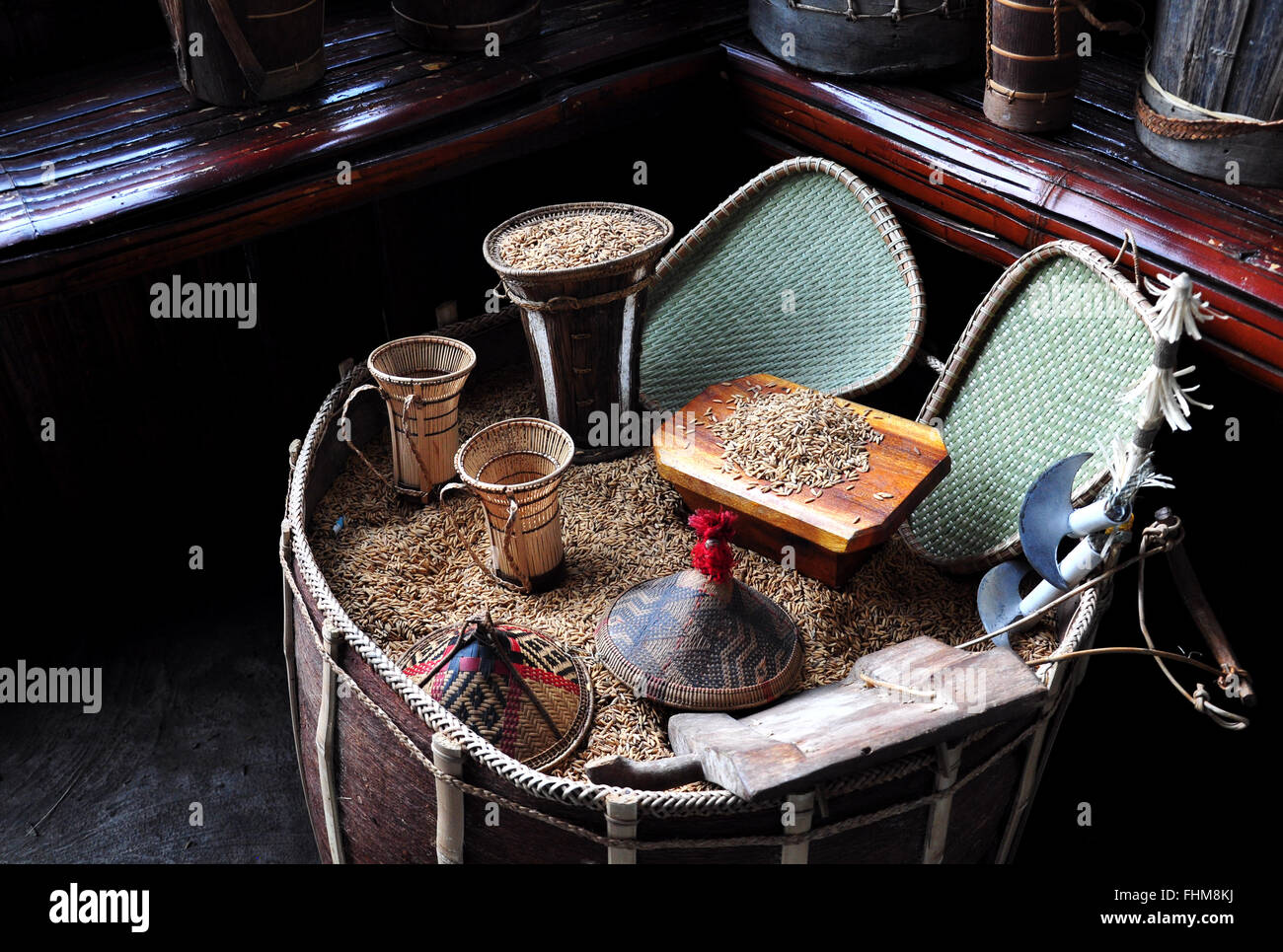 Miniatures of traditional paddy harvesting tools and accessories in ...