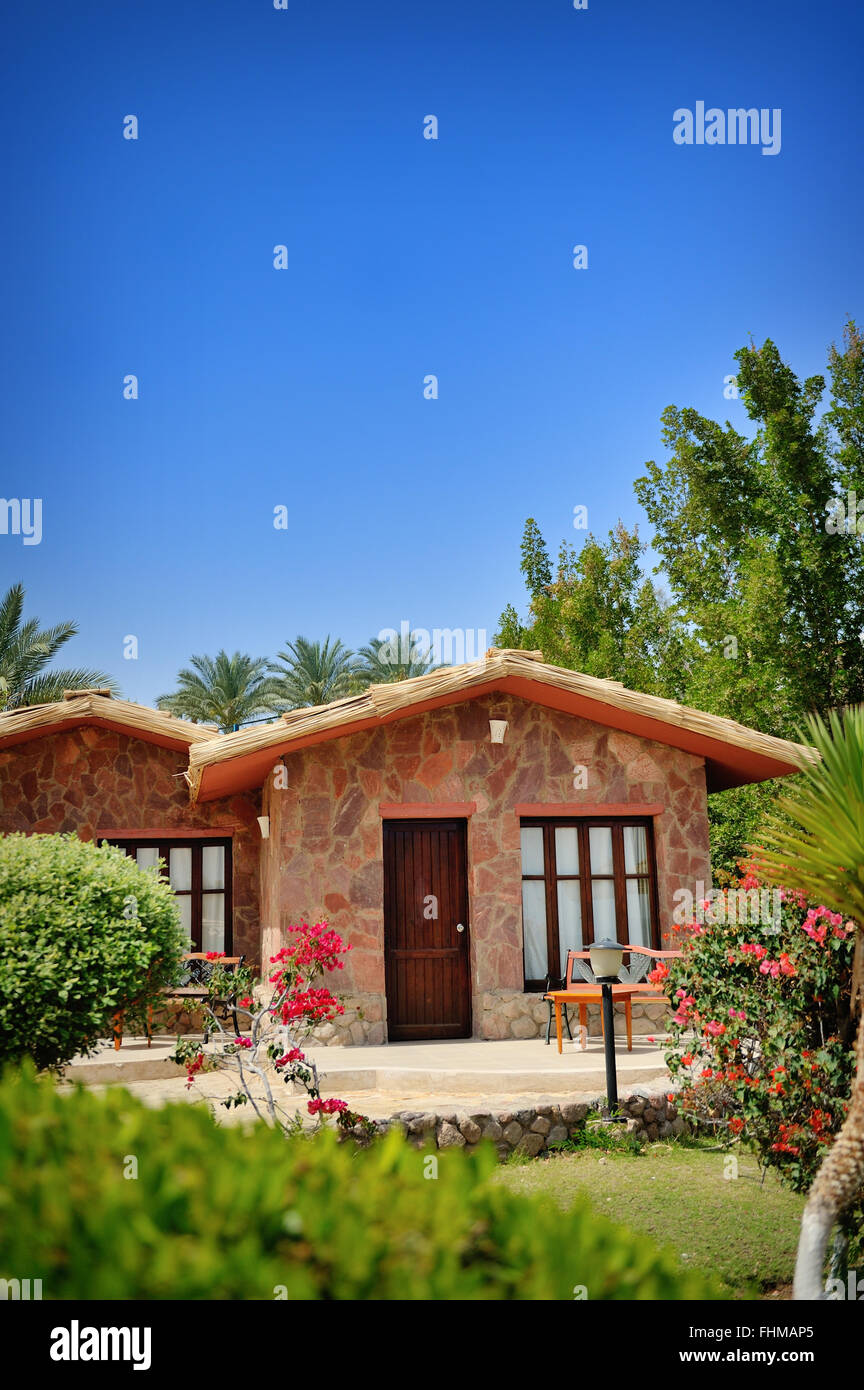 beautiful lodge planted flowering shrubs Stock Photo - Alamy