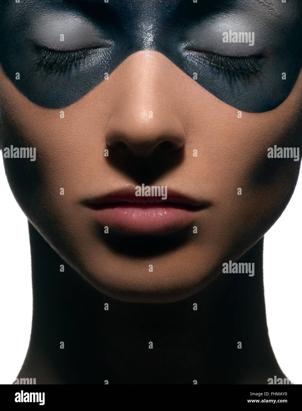 A close up of a woman with painted face mask Stock Photo - Alamy