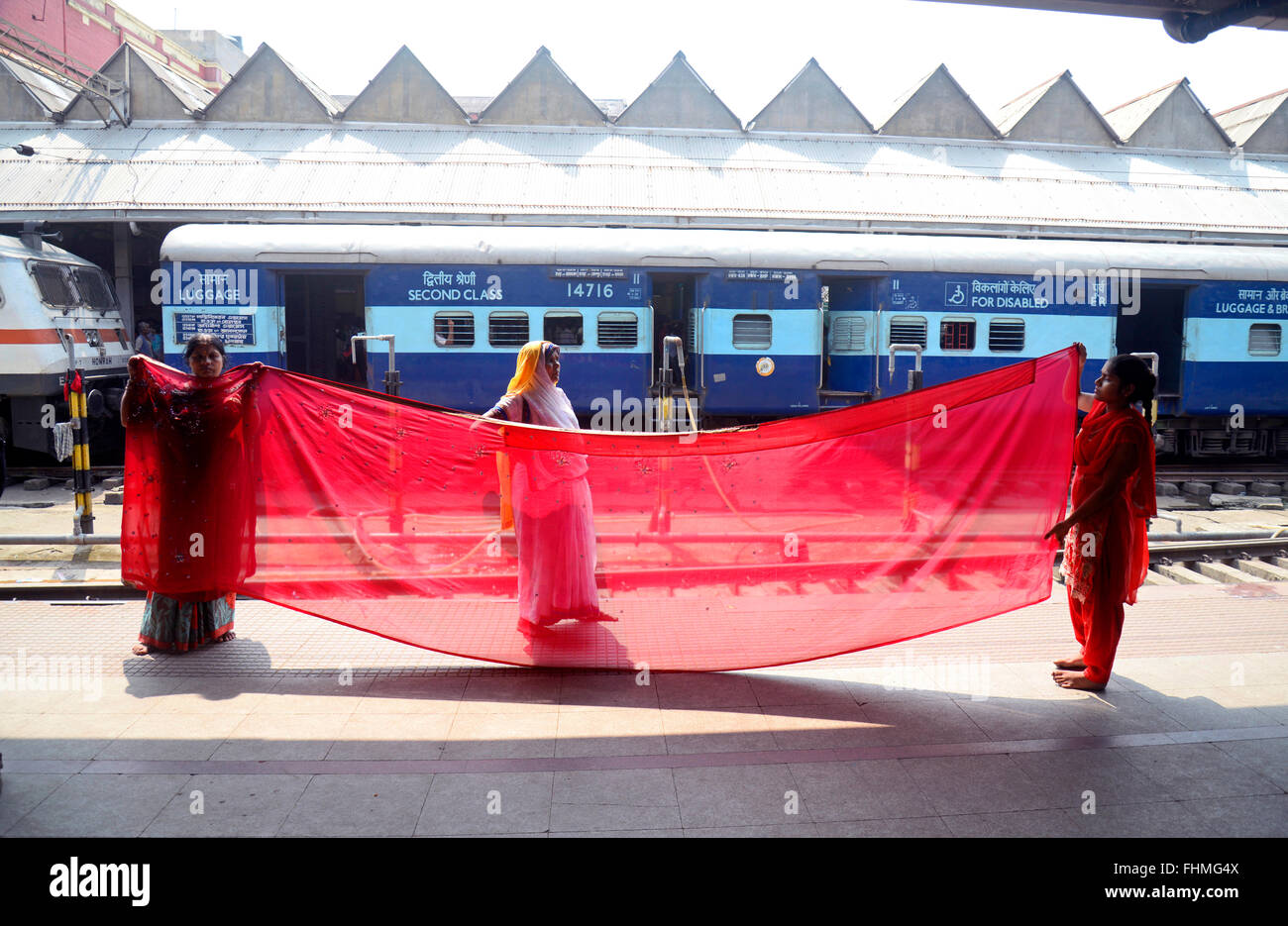 Kolkata, India. 18th Oct, 2015. Poor people waiting for train in ...