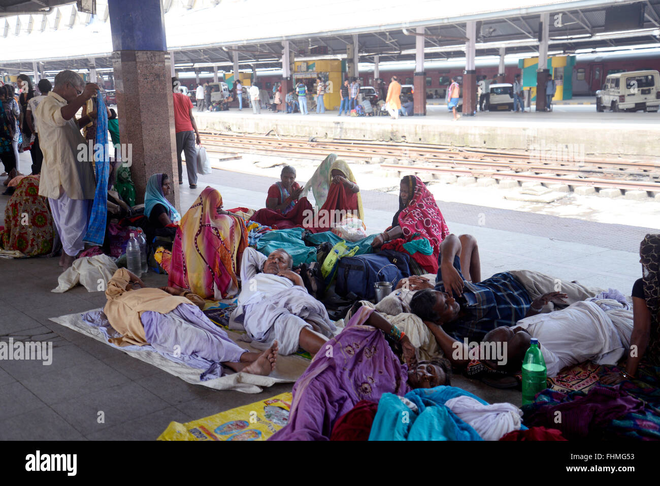 Kolkata, India. 18th Oct, 2015. Poor people waiting for train in ...