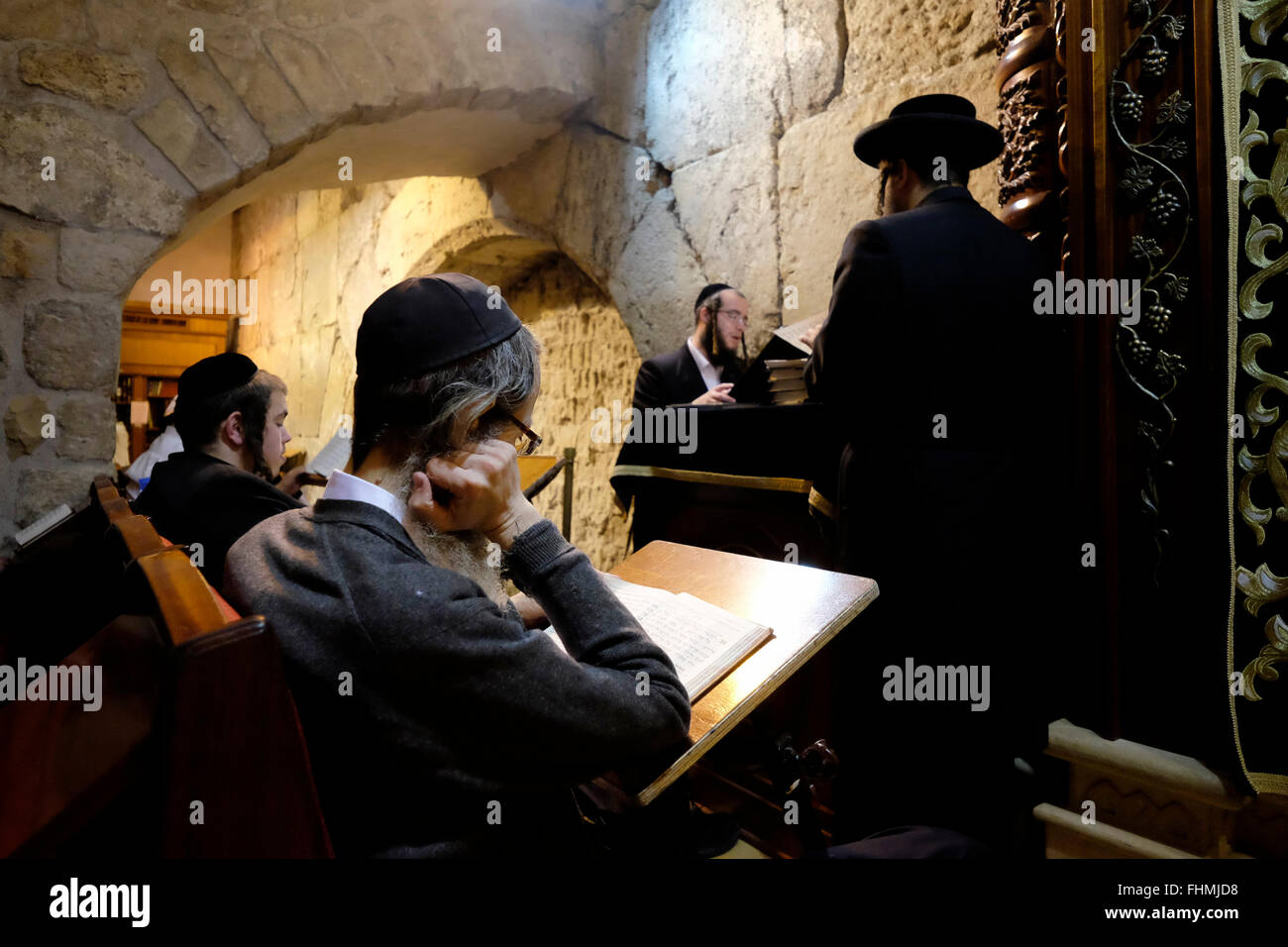 Orthodox religious Jews pray in a synagogue at the underground Western ...