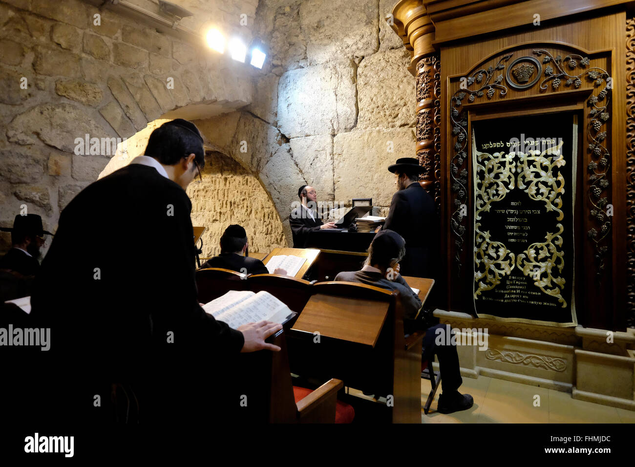 Orthodox religious Jews pray in a synagogue at the underground Western ...