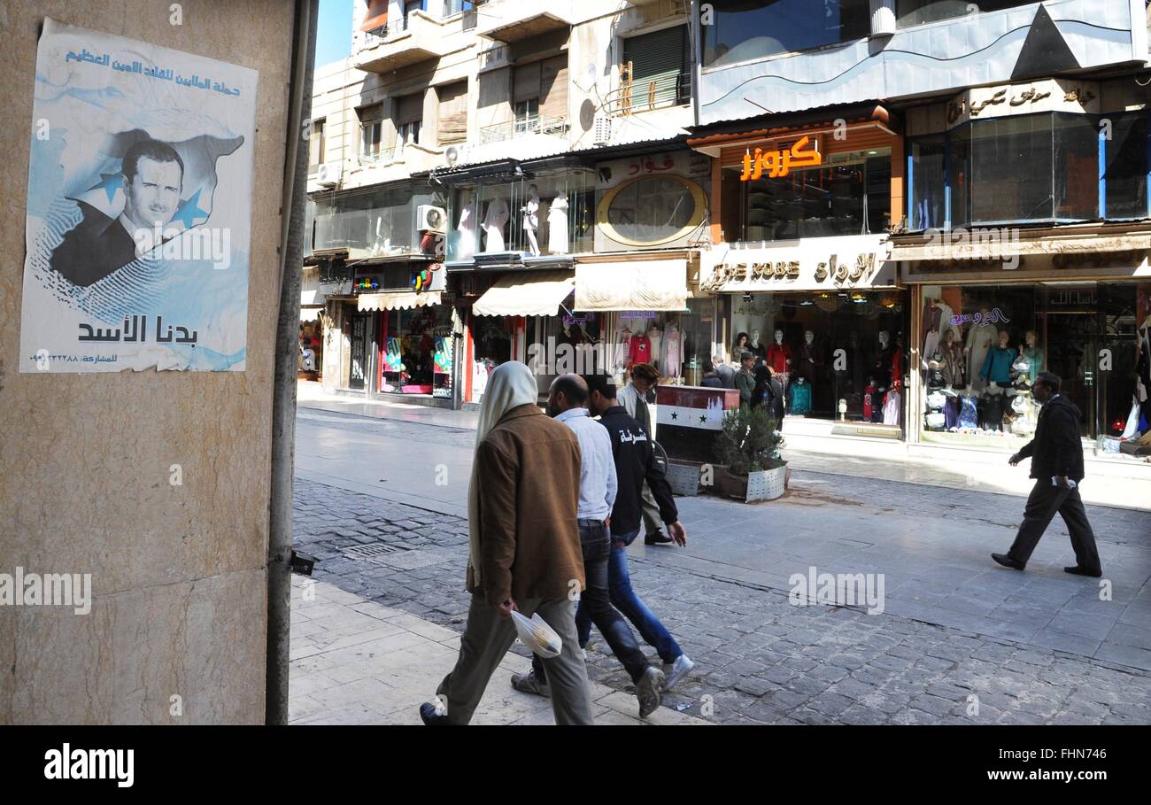 Damascus, Syria. 25th Feb, 2016. Syrians walk at the Abed Street in ...