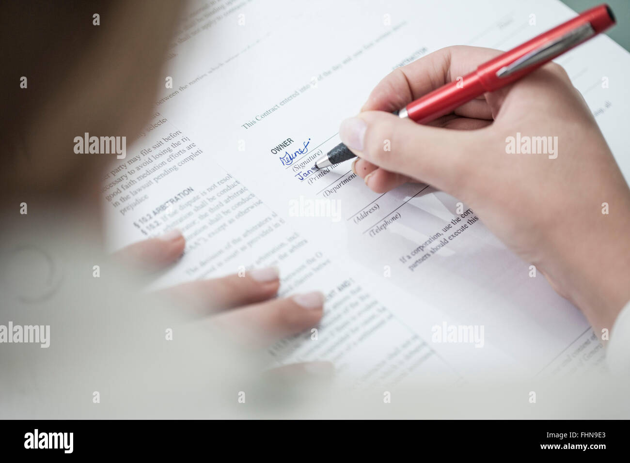 Woman desk signing documents close up hi-res stock photography and ...