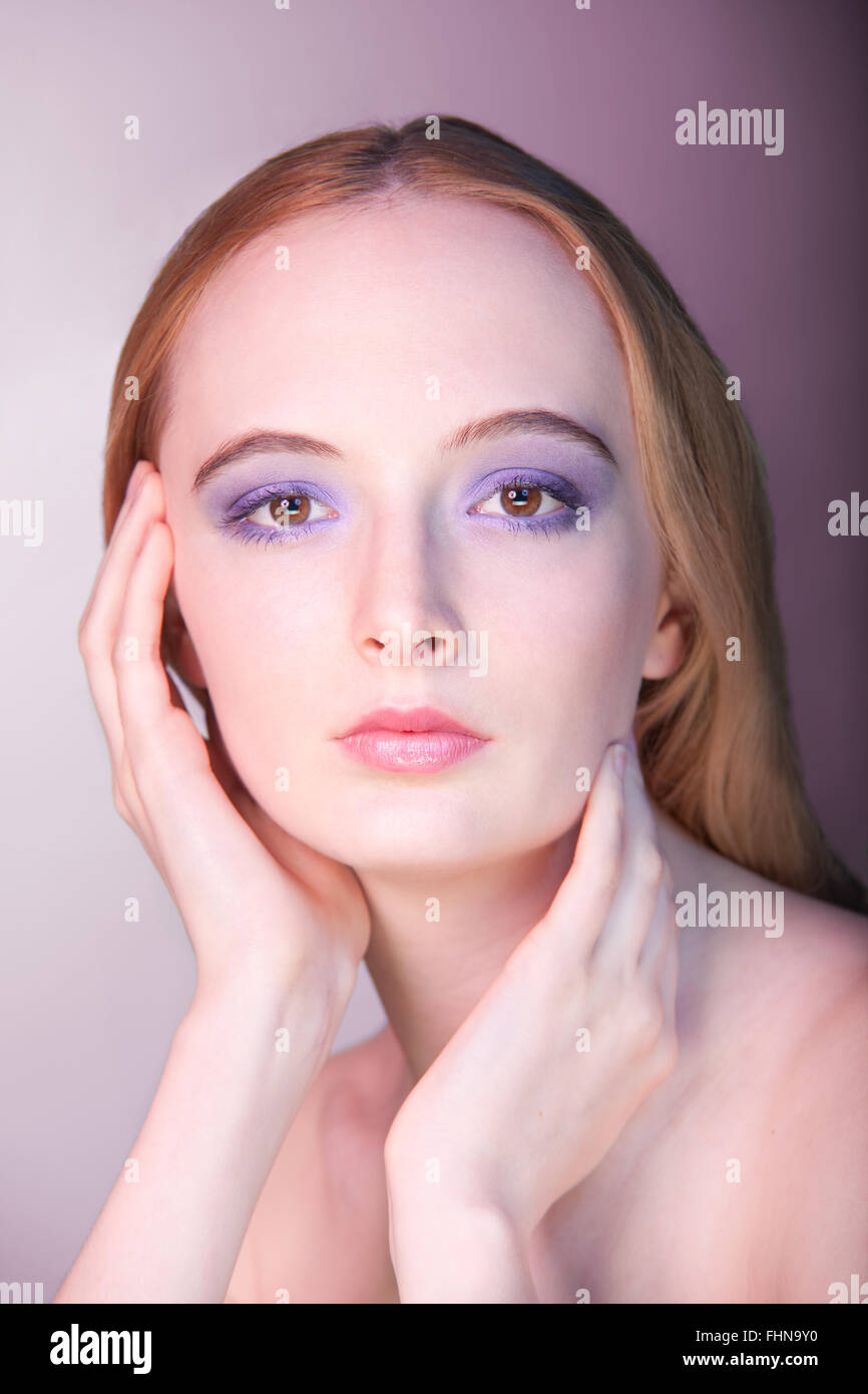 A woman wearing purple eyeshadow Stock Photo - Alamy