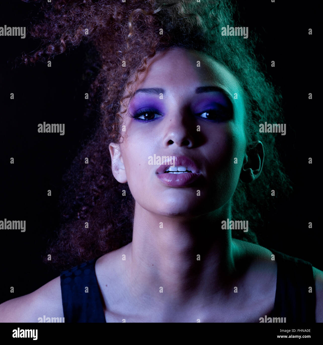 A model wearing makeup with dramatic lighting Stock Photo - Alamy