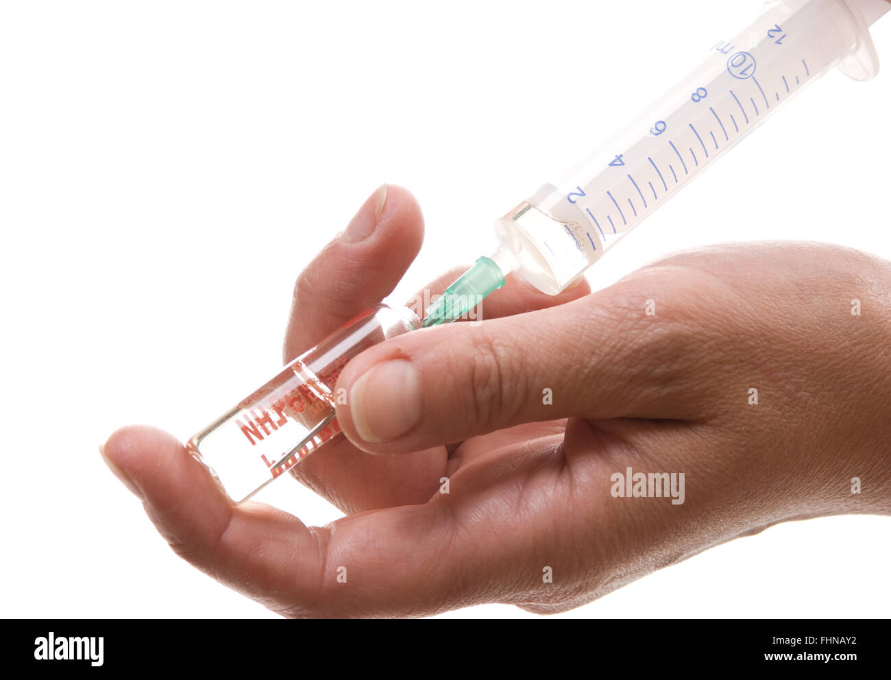 syringe in his hand Stock Photo - Alamy
