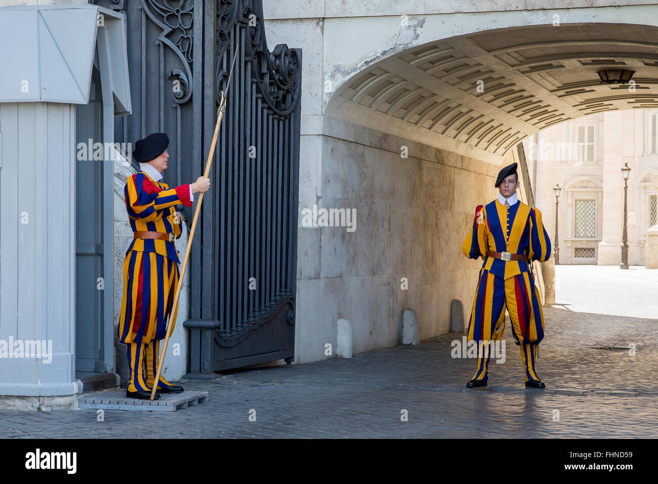 Members of the Pontifical Swiss Guard with halberd on duty at the ...