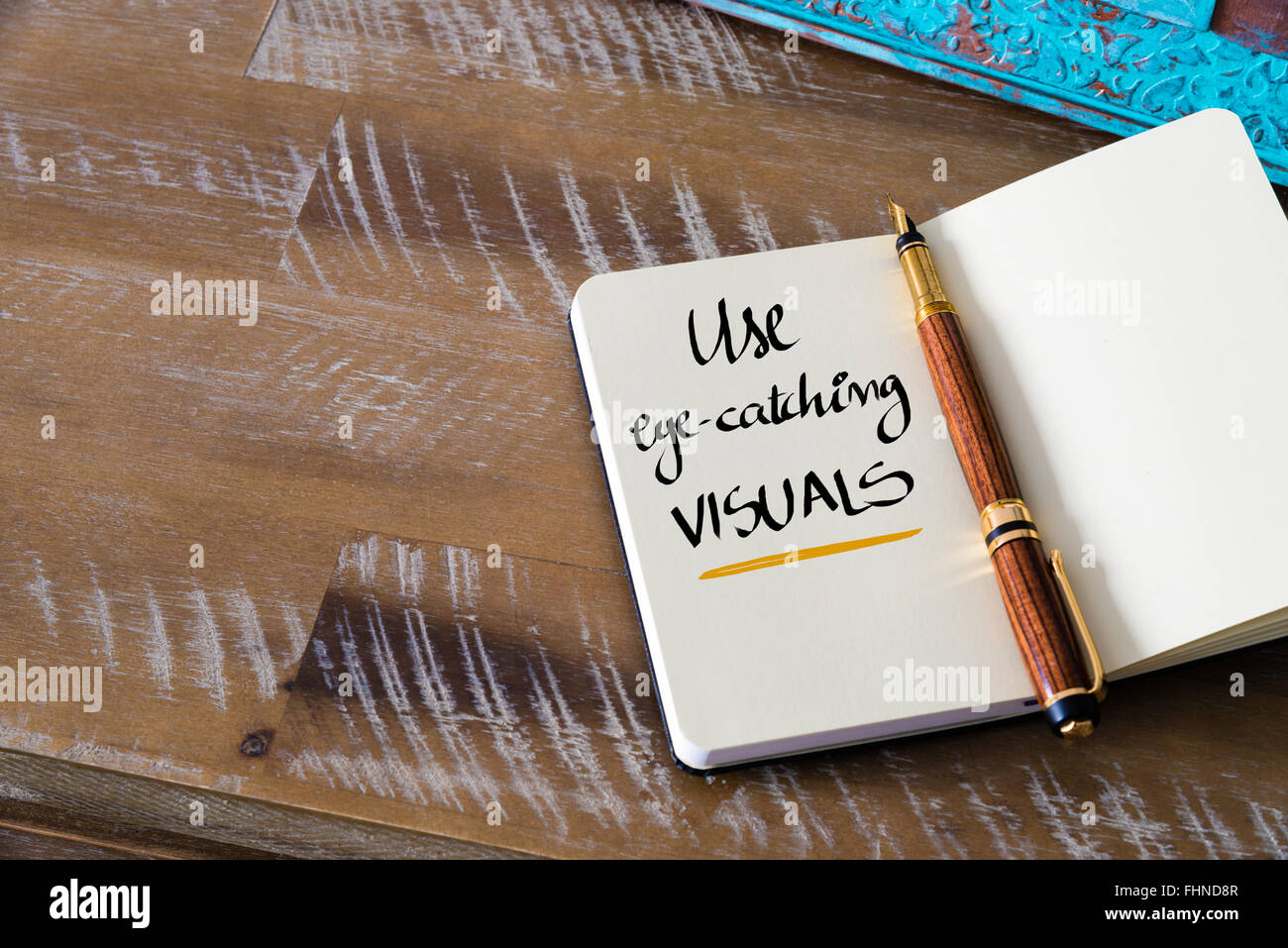 Business concept image with handwritten text USE EYE-CATCHING VISUALS ...