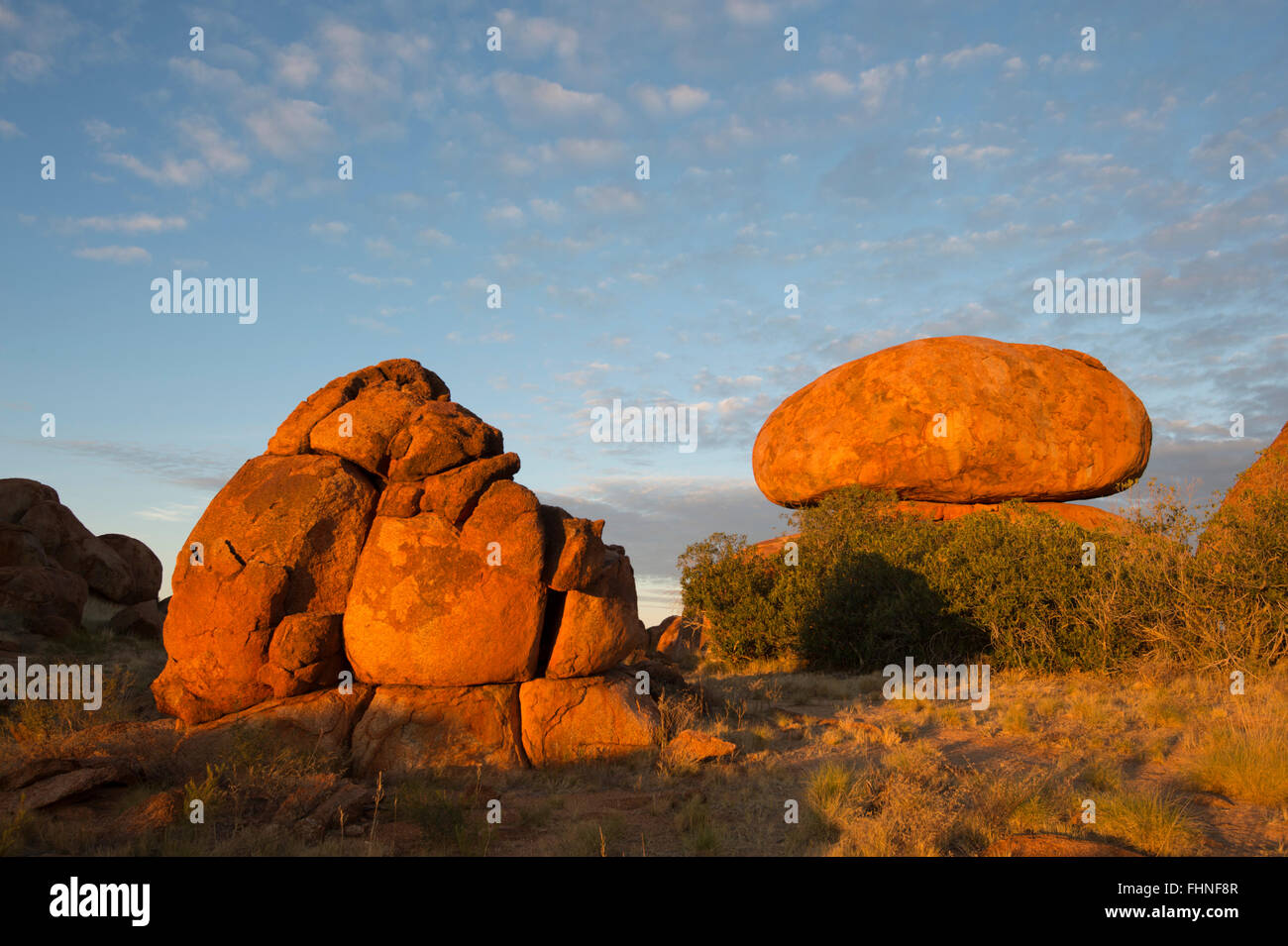 Red eroded granite boulders at Devil's Marbles, a popular tourist ...