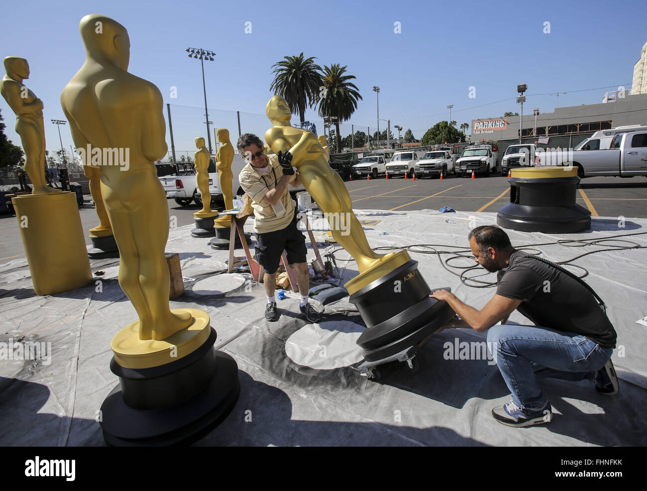 Los Angeles, California, USA. 25th Feb, 2016. Workers transport an ...