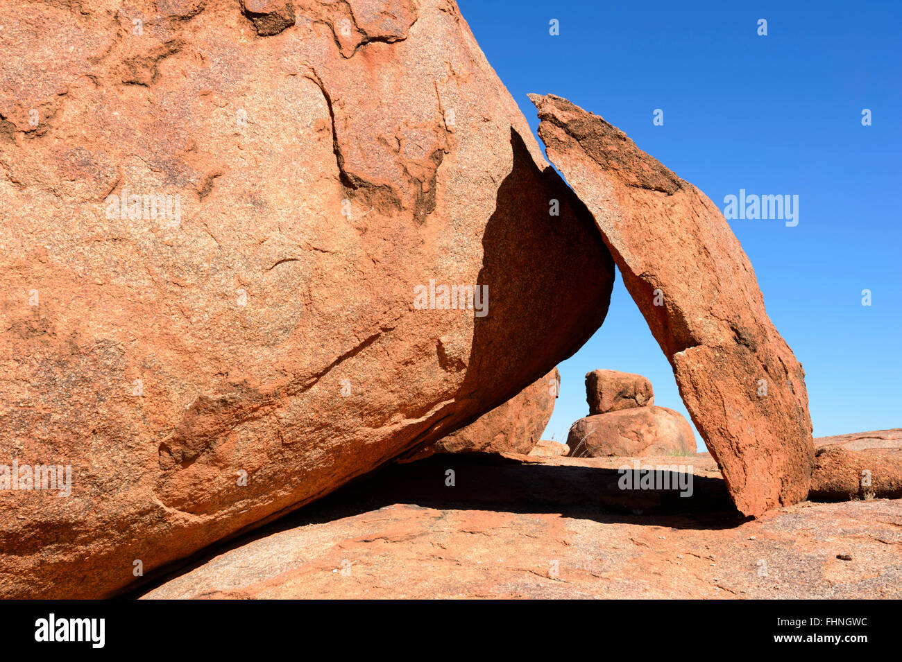 Red eroded granite boulders at Devil's Marbles, a popular tourist ...