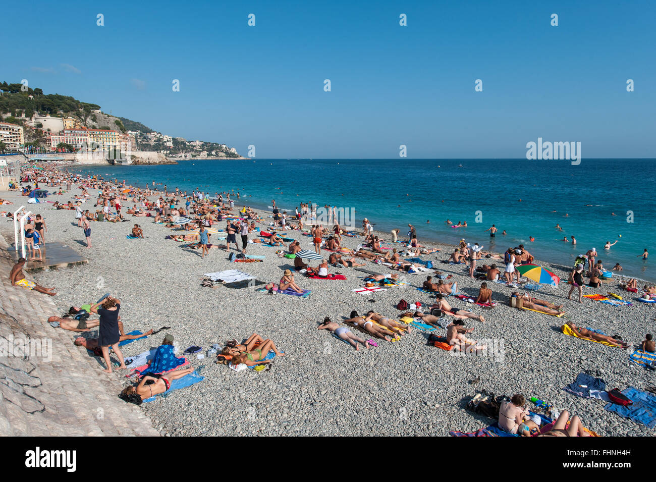The busy beach at Nice in Summer Stock Photo - Alamy