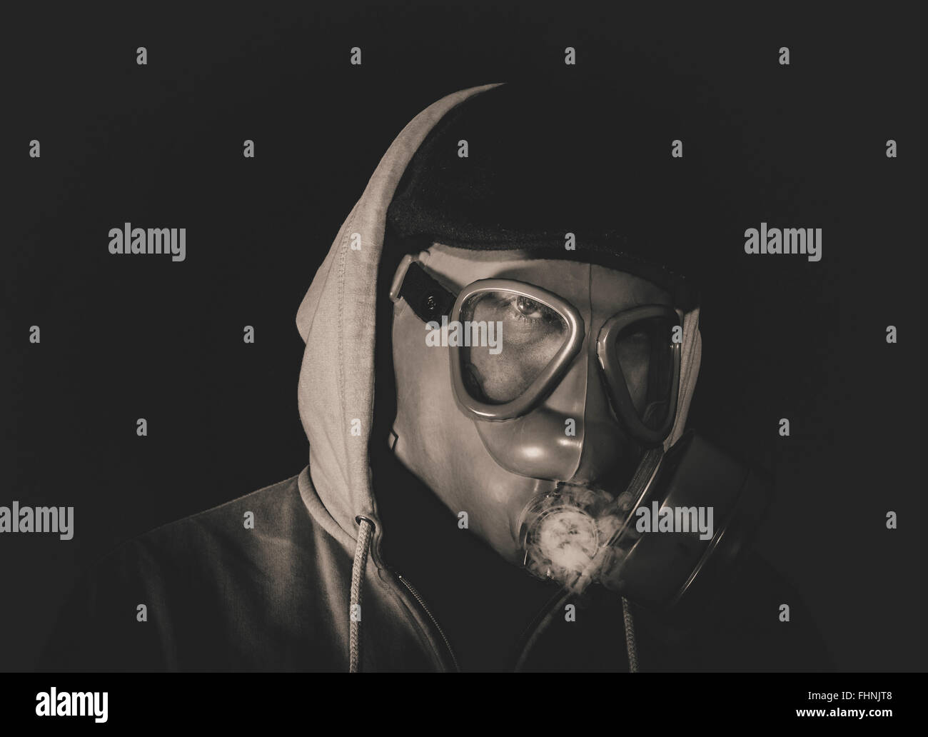 Man wearing mask and smoking,low key and monochrome Stock Photo - Alamy