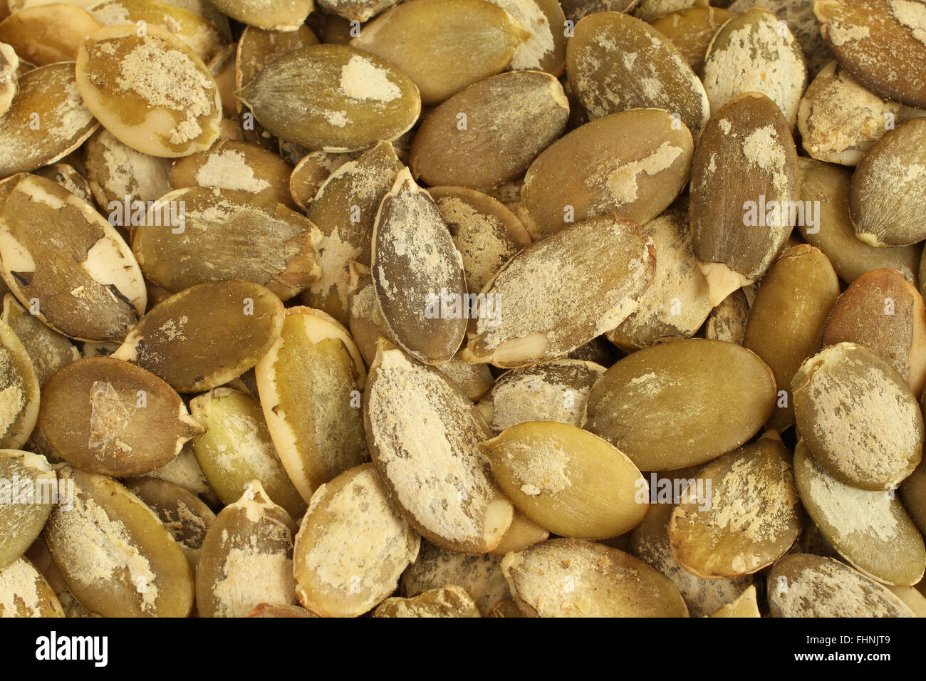 Food background - big shelled pumpkin seeds Stock Photo - Alamy