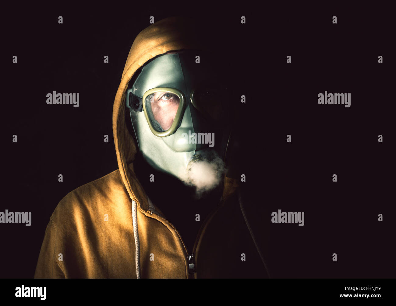 Man with mask on his face smoking Stock Photo - Alamy