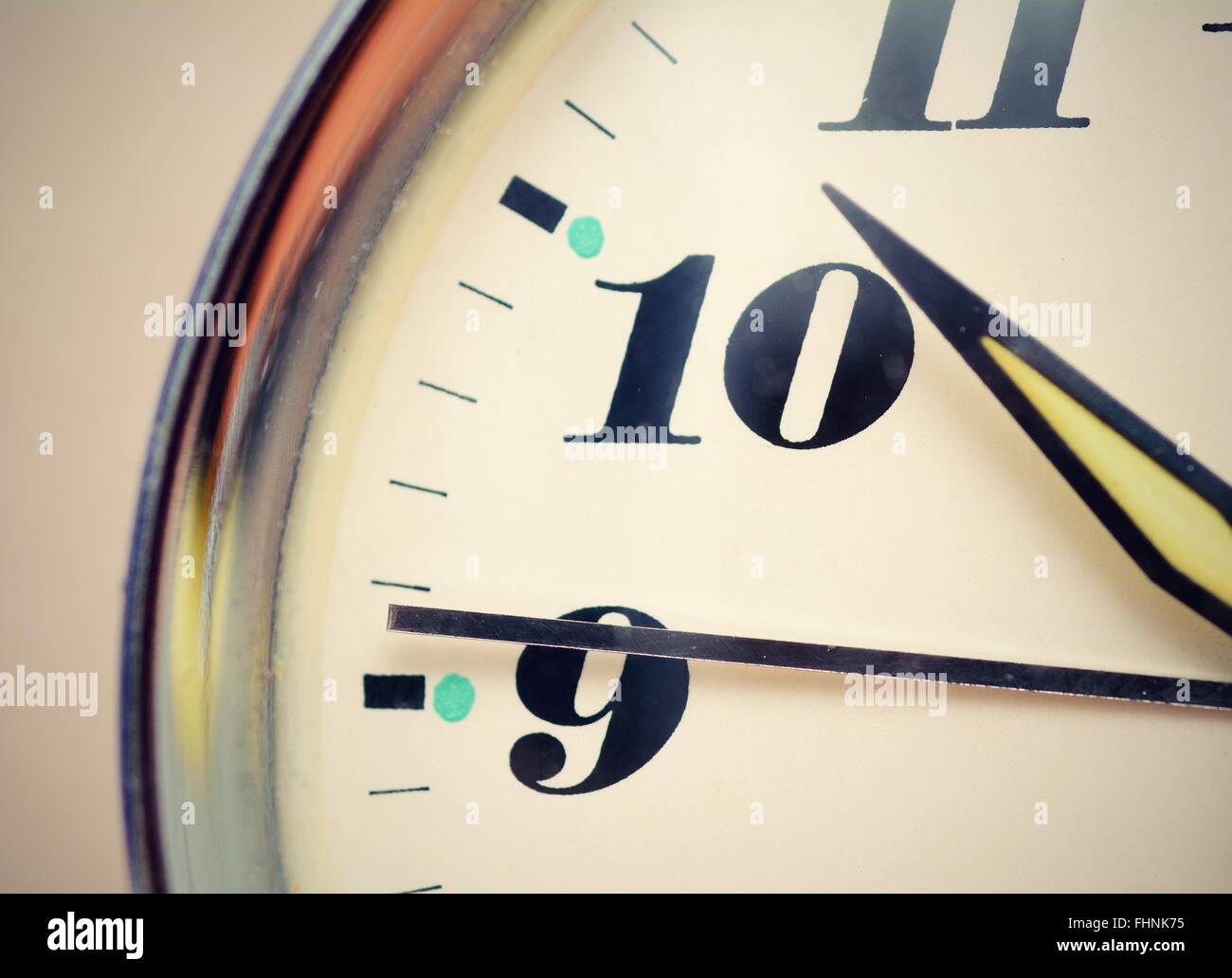 Conceptual shot of the old dial with ten clock. Retro color effect ...