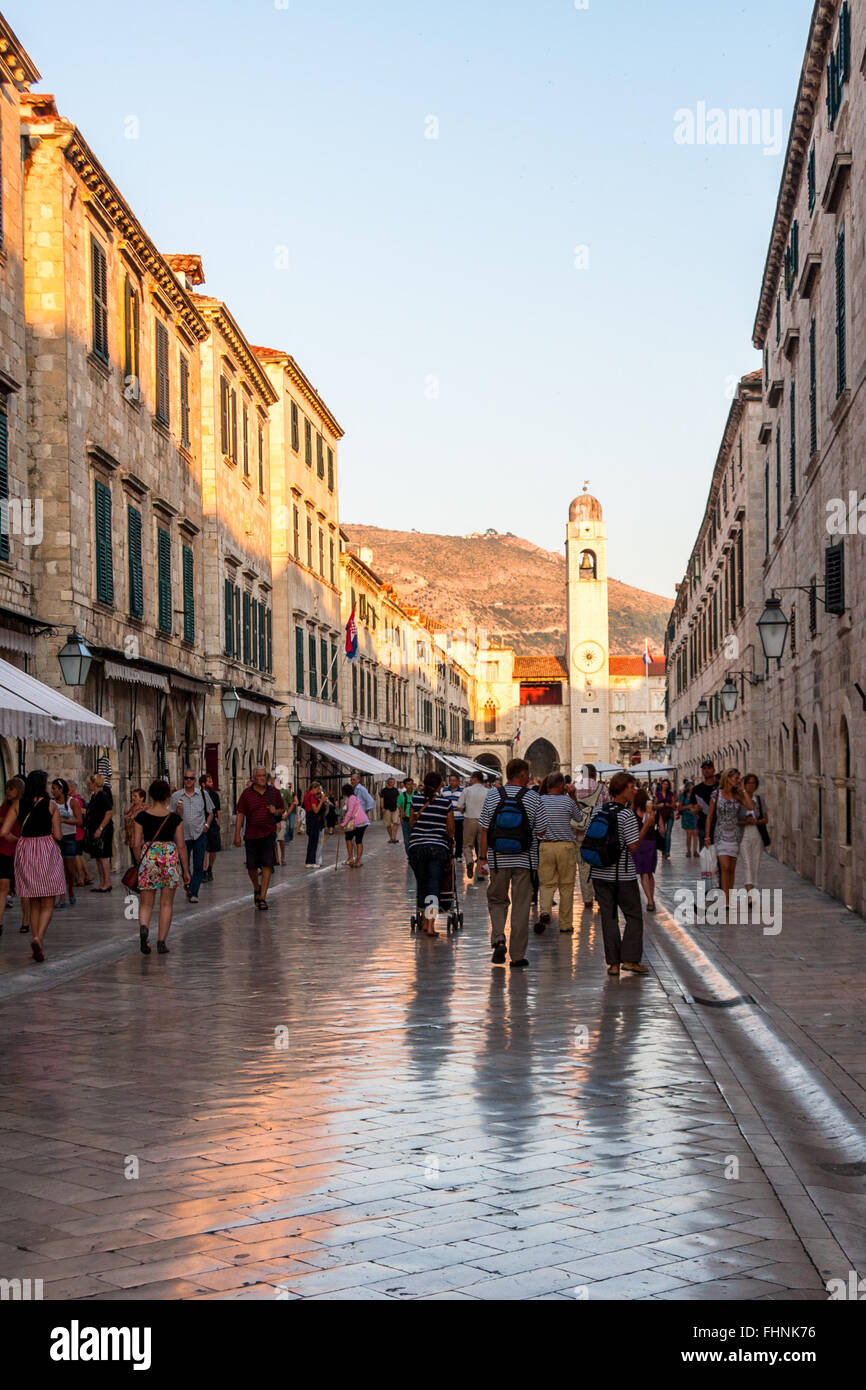 Tourists walk along the marble streets of Dubrovnik Old Town in Croatia ...