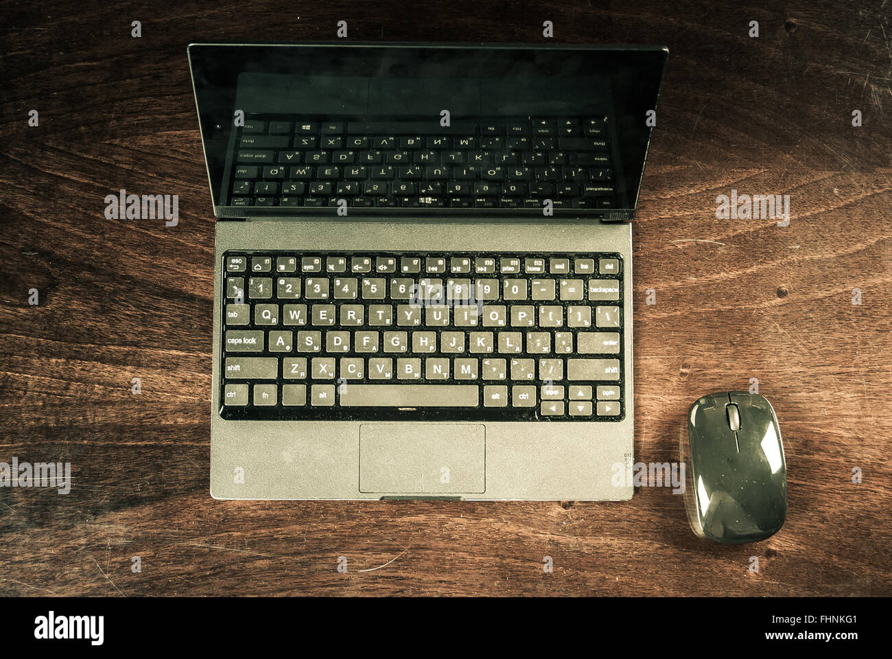 black laptop on wood Stock Photo - Alamy