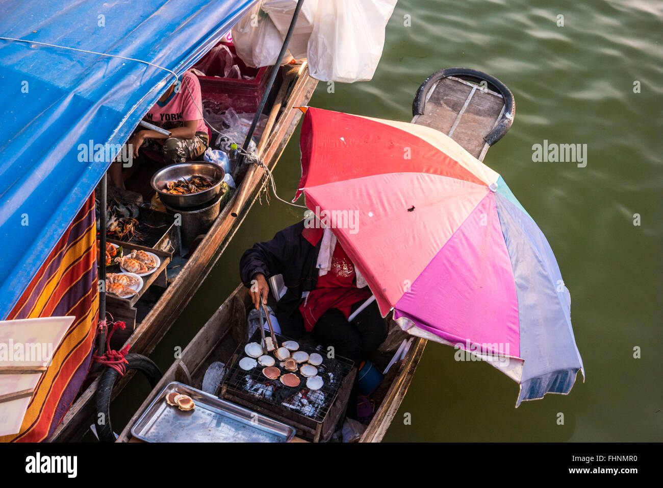 Trader's boats in a floating market in Thailand Stock Photo - Alamy