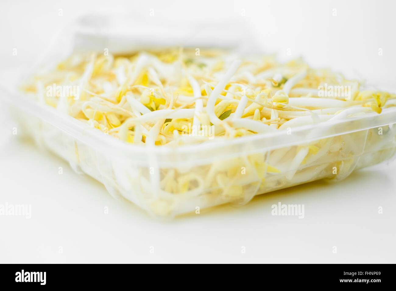 Bean sprouts in packaging on a white background Stock Photo - Alamy