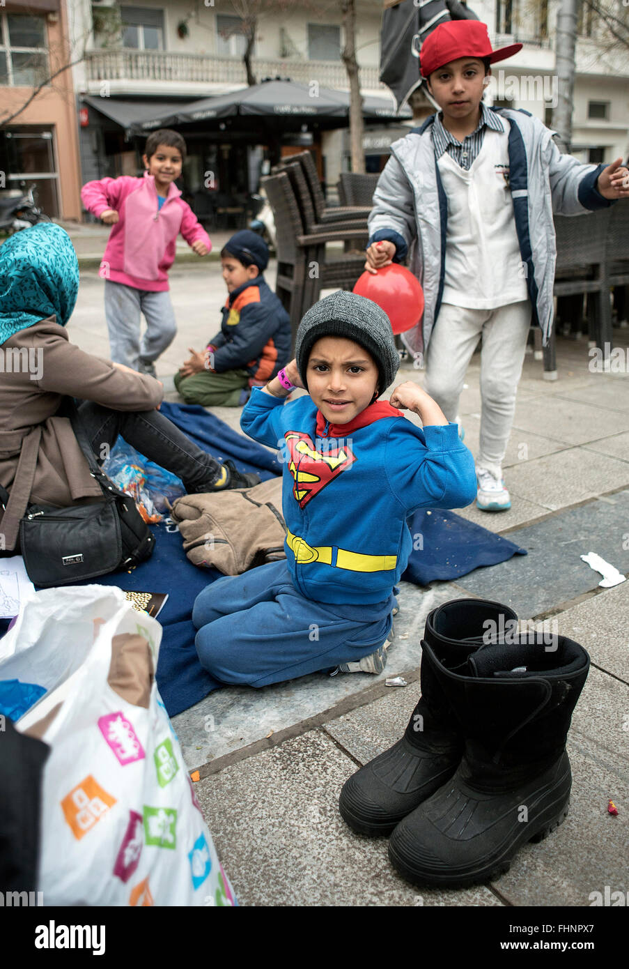 Athens, Greece. 24th Feb, 2016. Afghan migrants wait in Victoria square ...