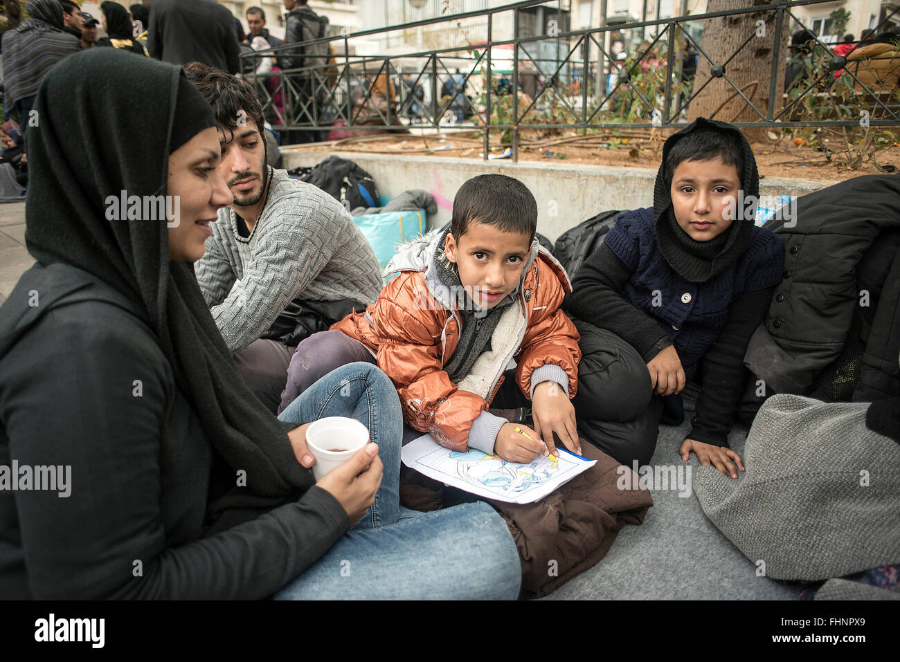 Athens, Greece. 24th Feb, 2016. Afghan migrants wait in Victoria square ...