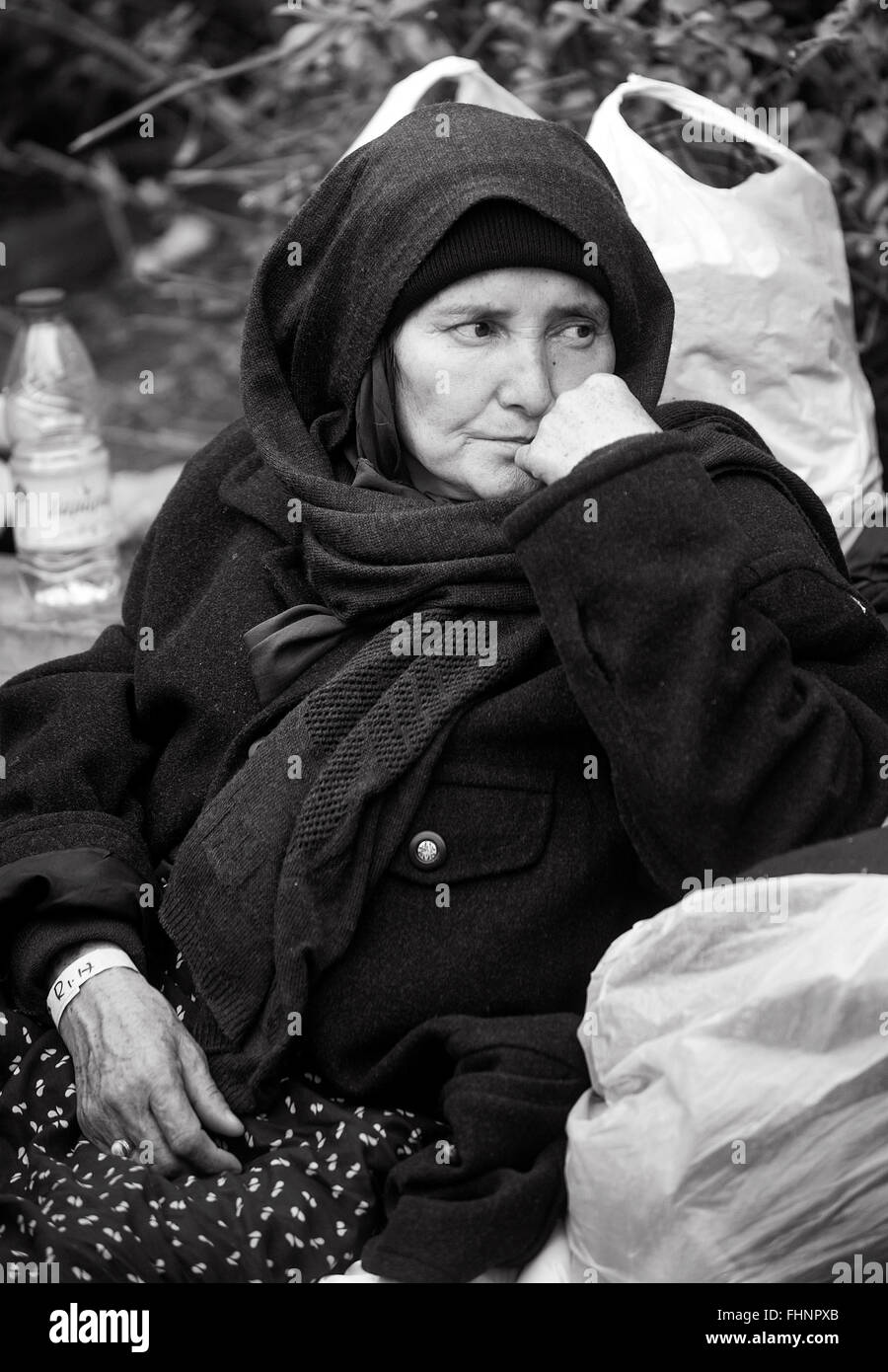 Athens, Greece. 24th Feb, 2016. Afghan migrants wait in Victoria square ...