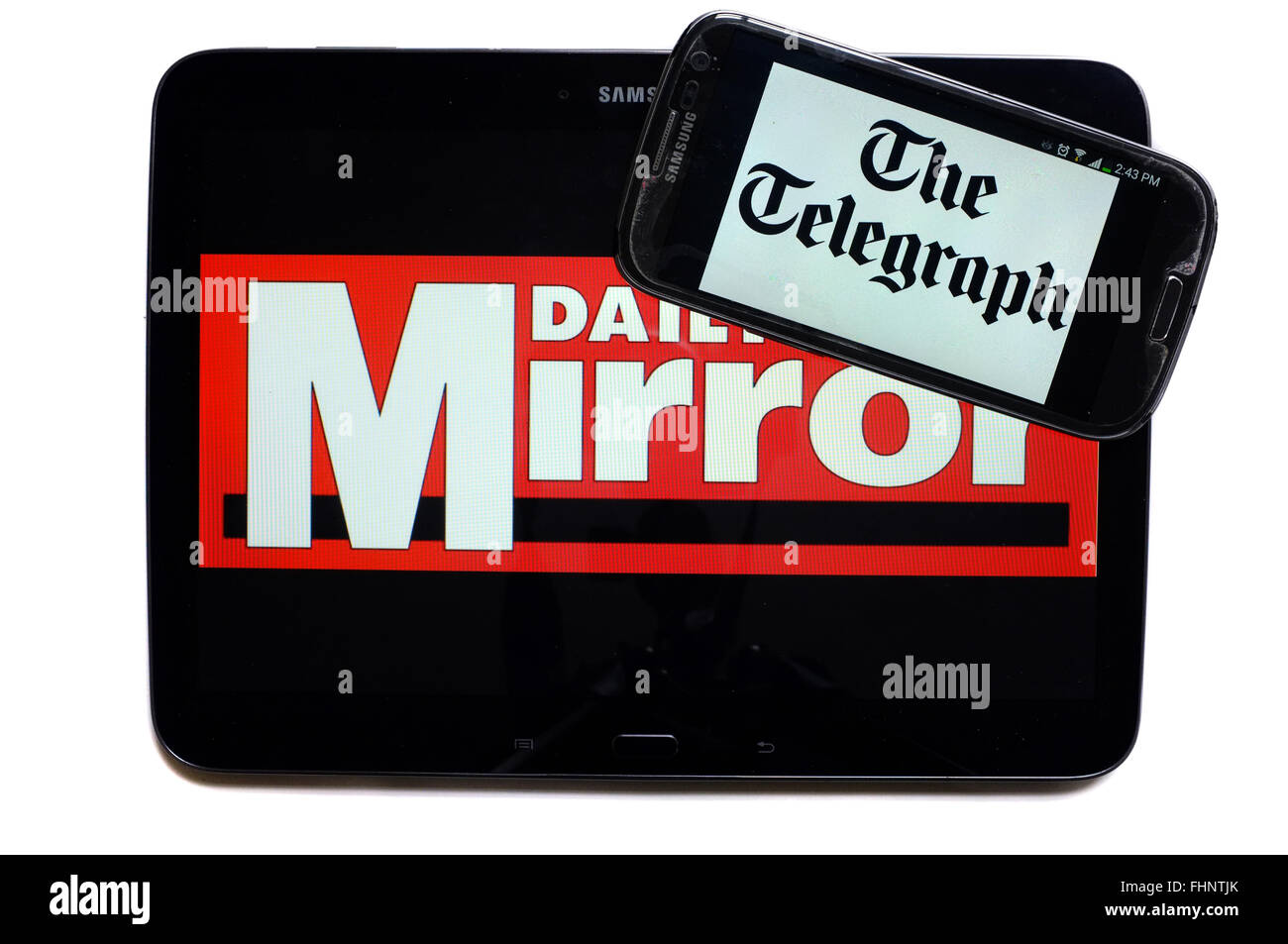 The logos of the Daily Mirror and The Telegraph newspapers displayed on ...