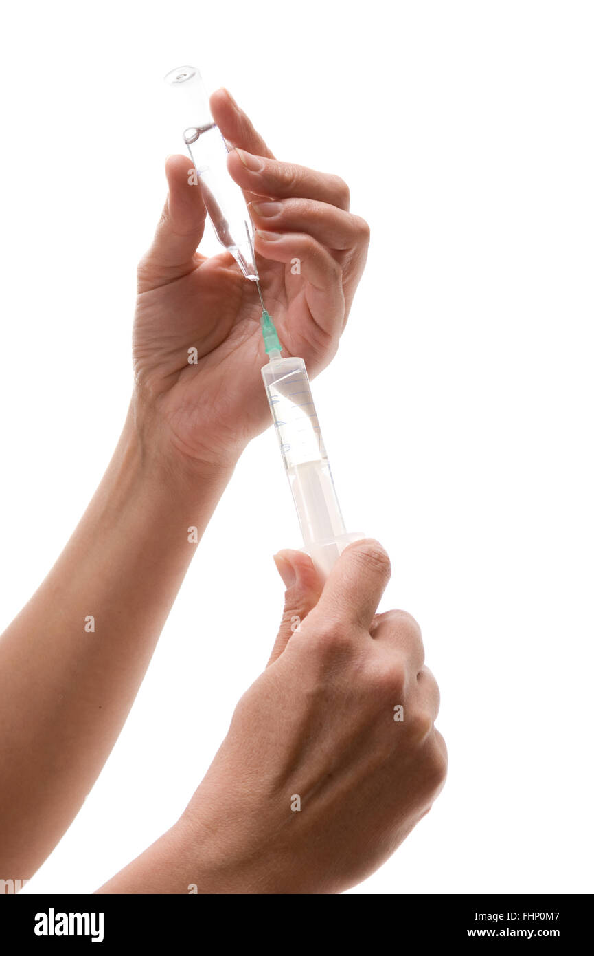 syringe in his hand Stock Photo - Alamy