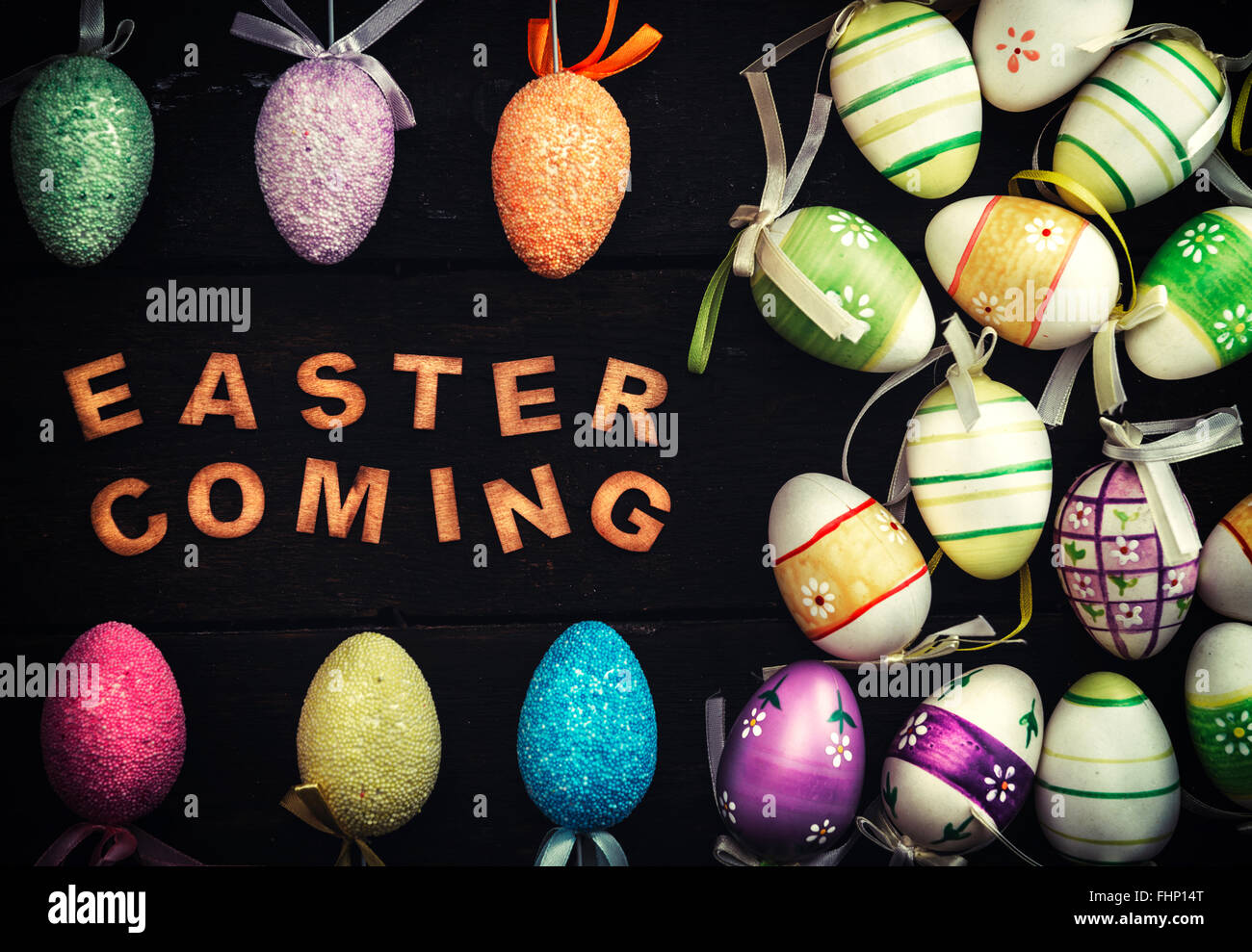 Easter coming concept with colorful eggs on wooden background,selective ...